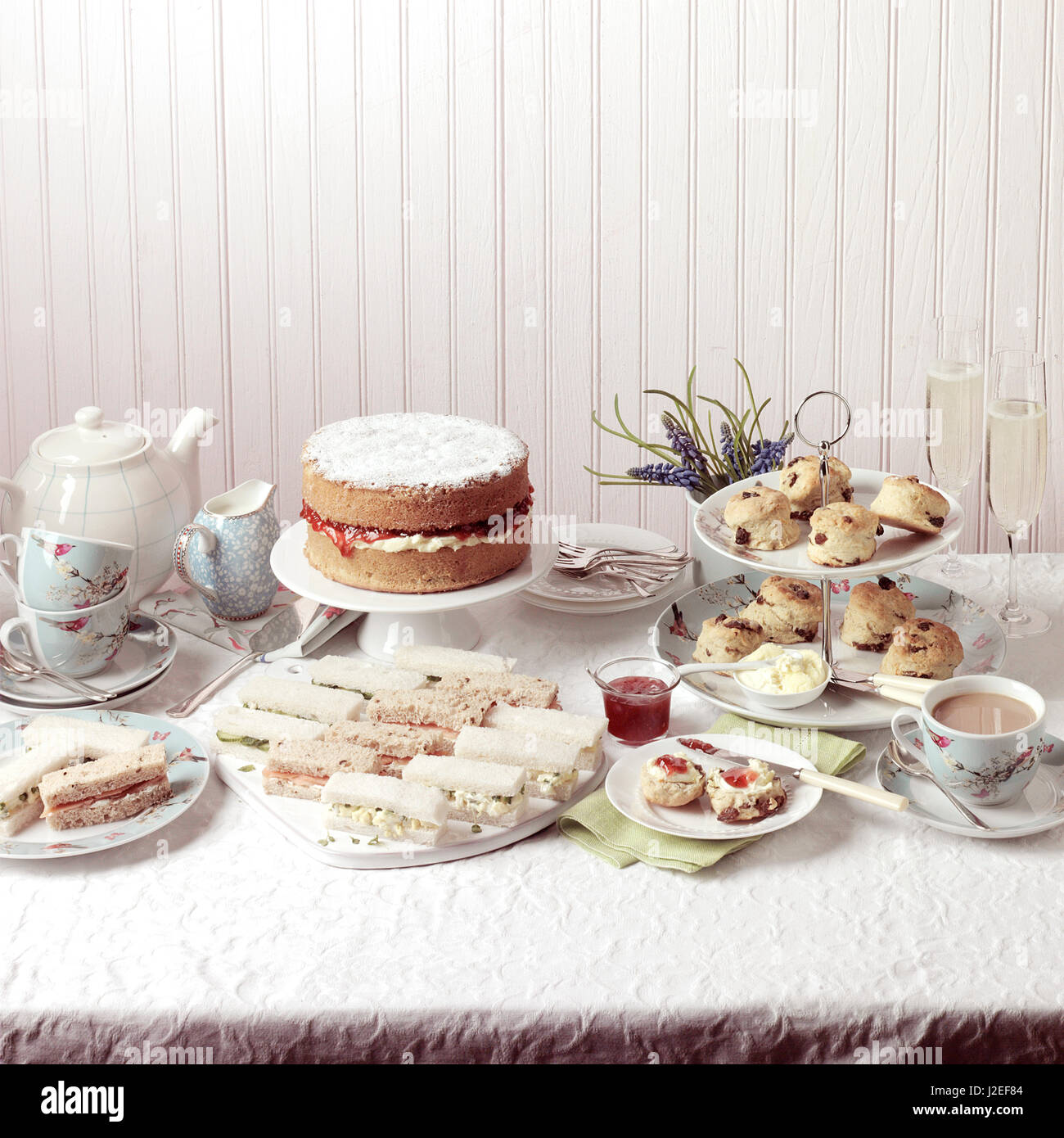 English tea spread with Victoria sponge cake Stock Photo - Alamy
