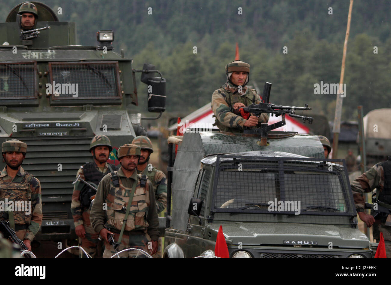 Srinagar, India. 27th Apr, 2017. Indian army personnel stand alerts ...