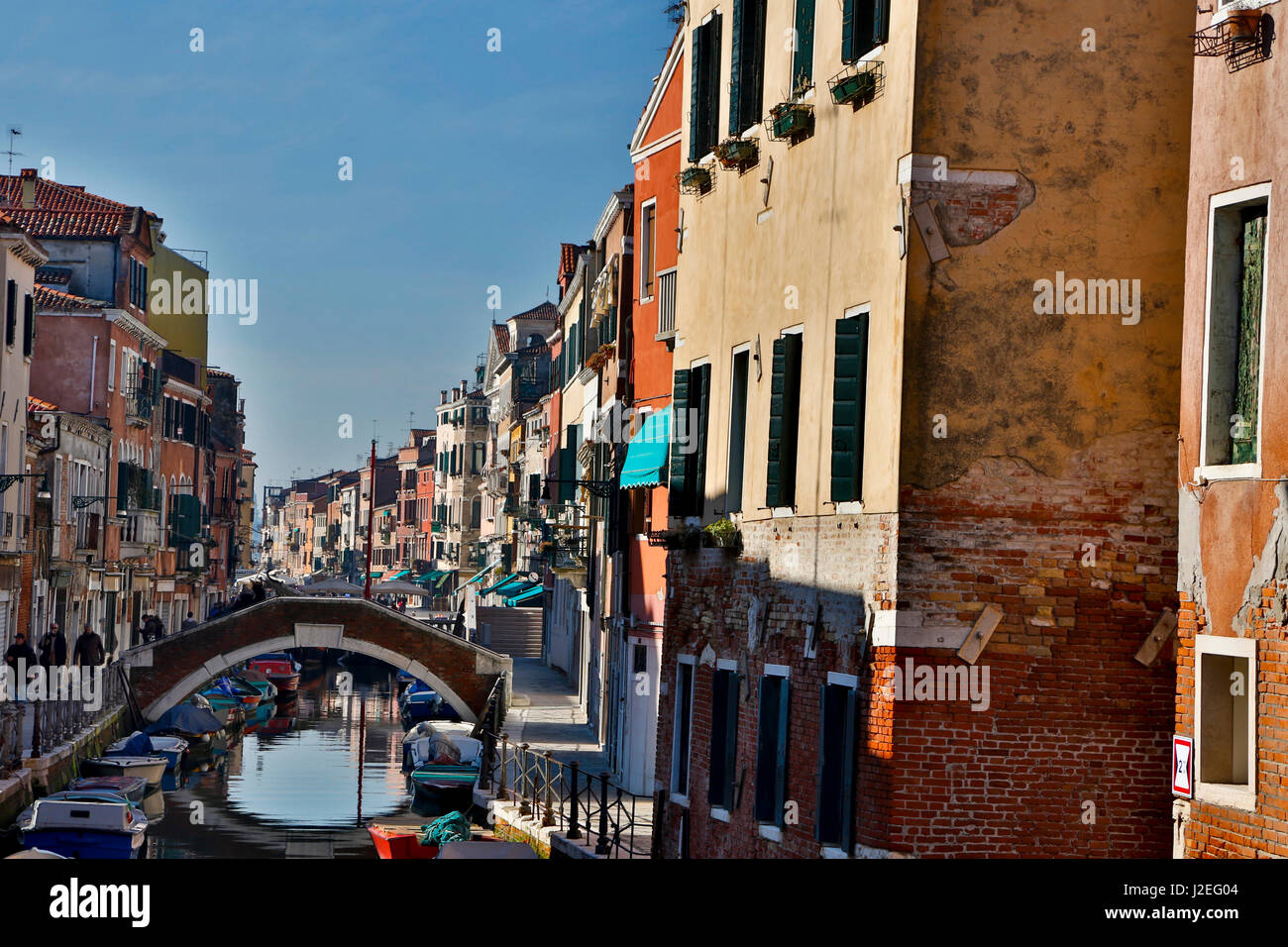 Work boats and Bridge along canals of Venice, Italy Stock Photo - Alamy