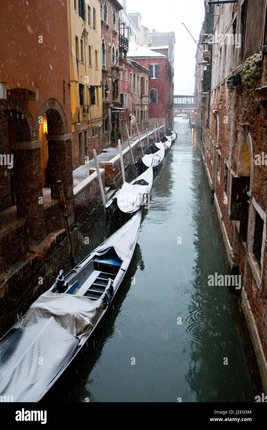 Canal with snow on Gondolas with Bridge Sigh as backdrop, Venice, Italy ...