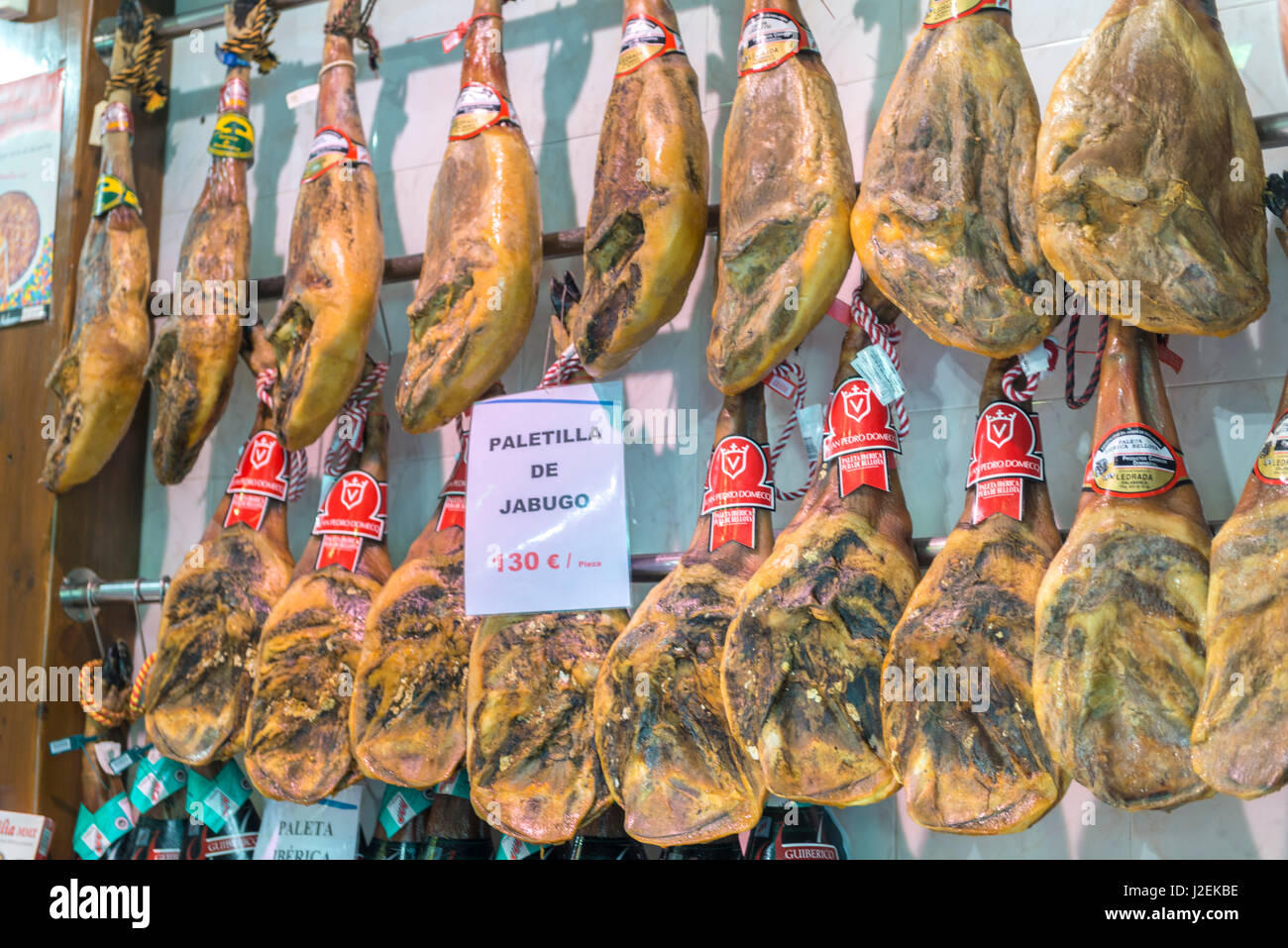 Spain, Barcelona, Iberico ham hanging in store (Large format sizes ...