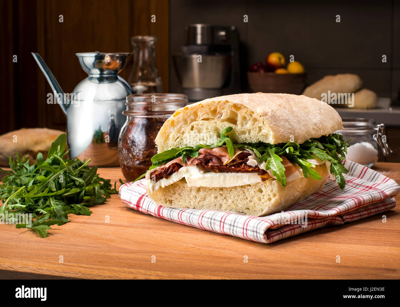 Panuozzo Sandwich on Wood Table Stock Photo - Alamy