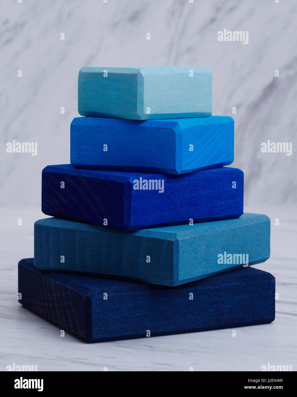 Stack of Blue Blocks on Marble Background Stock Photo - Alamy