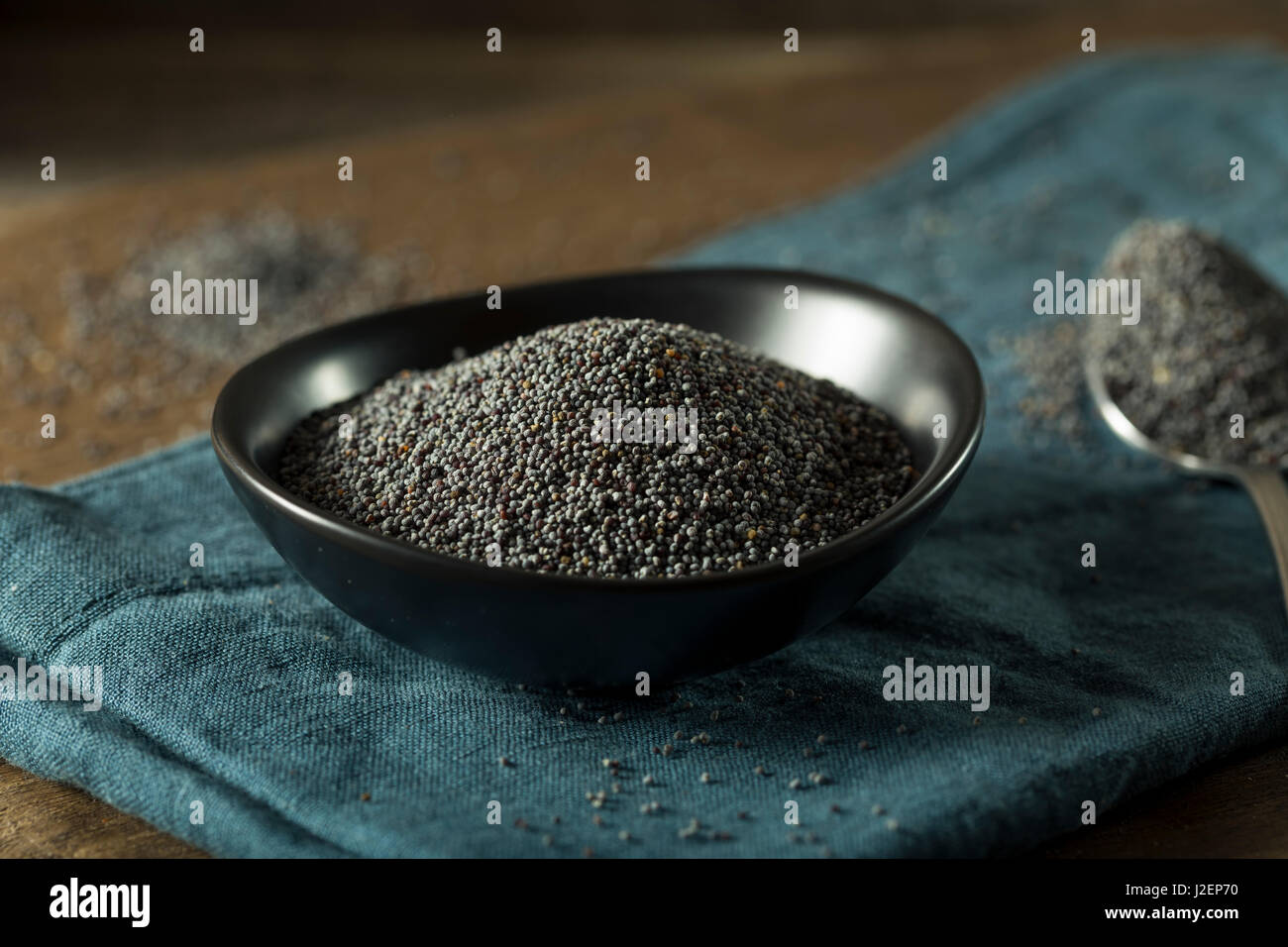 Raw Organic Black Poppy Seeds in a Bowl Stock Photo - Alamy