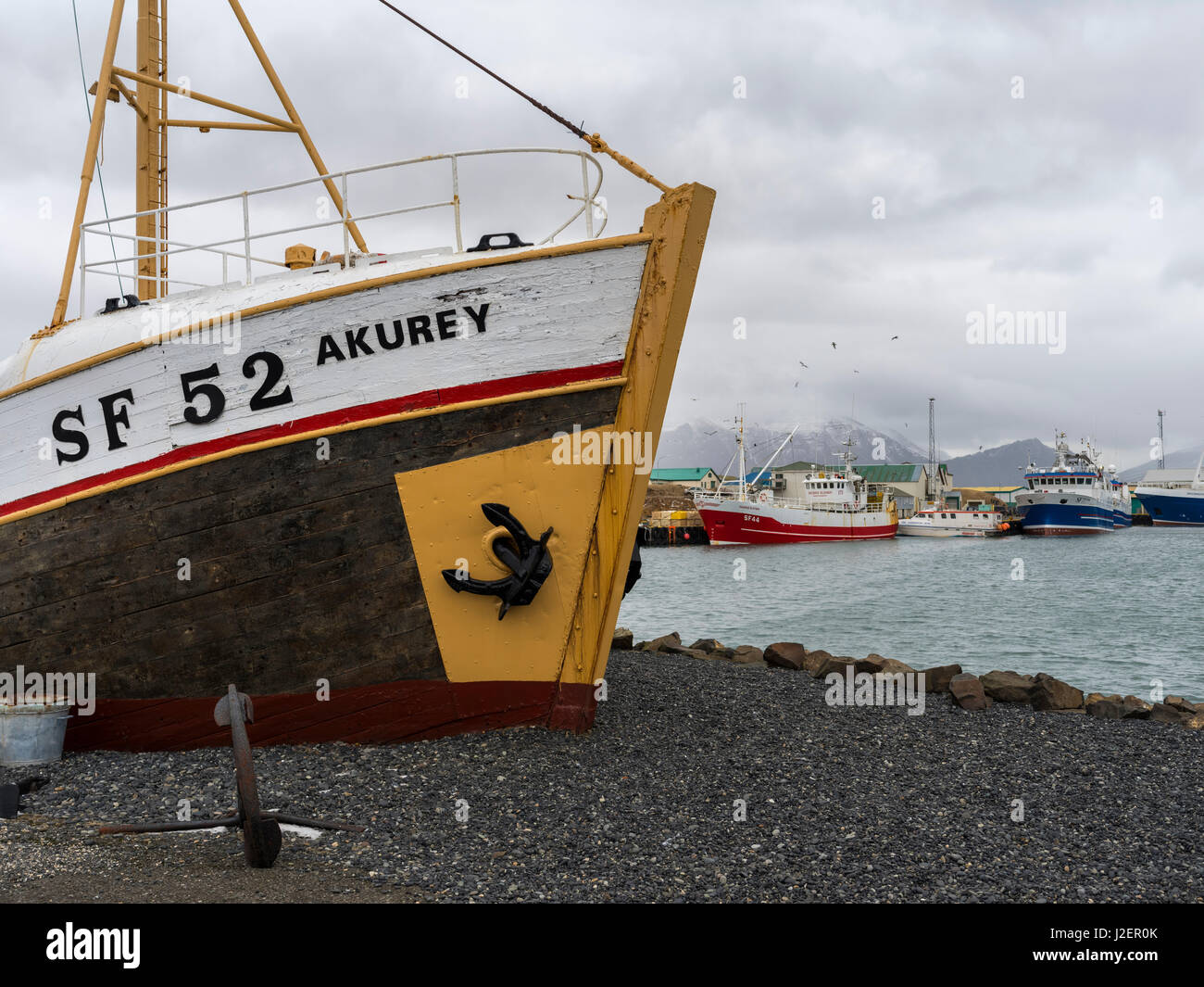 Town of Hofn during winter. Old ship used as a museum in the harbor ...