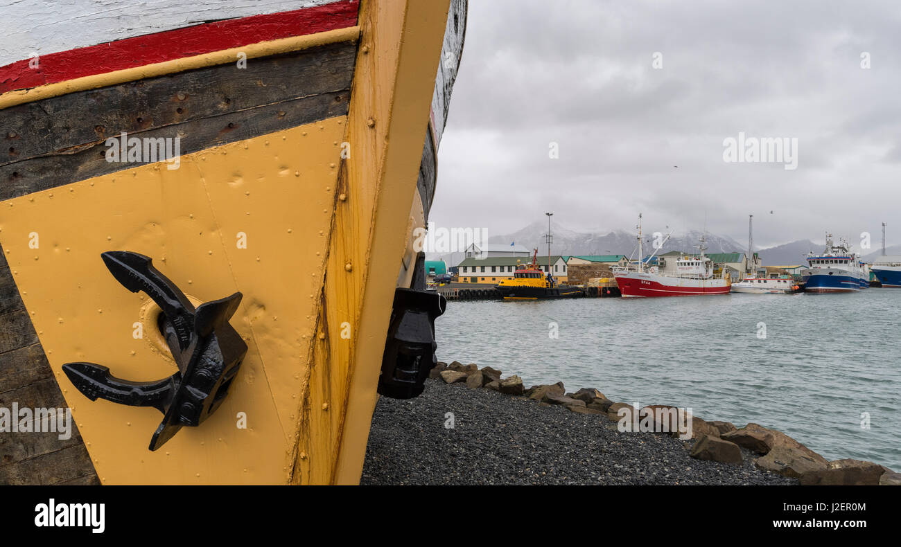 Town of Hofn during winter. Old ship used as a museum in the harbor ...