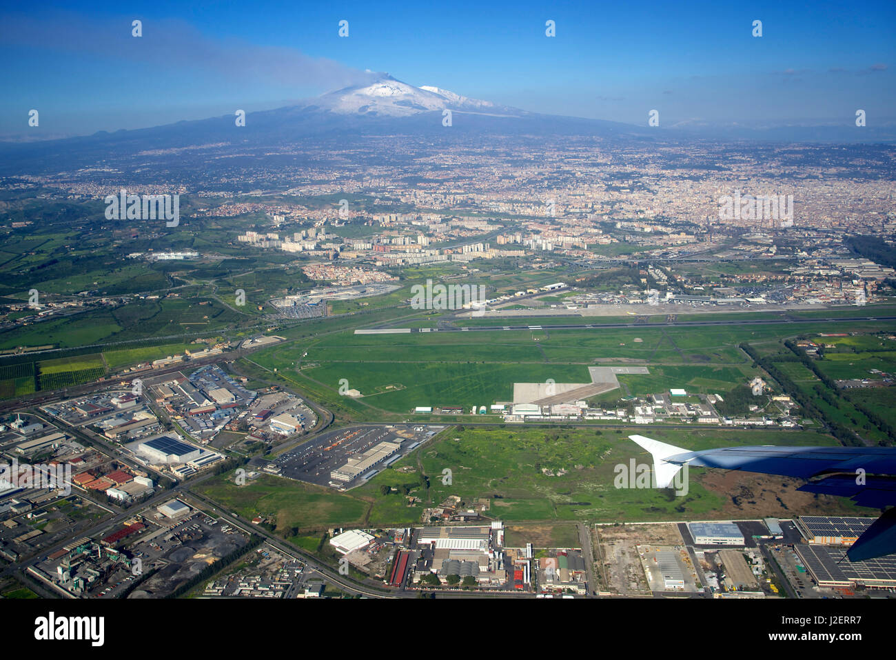 Italy, Sicily, aerial view of Mount Etna. Tip of Airbus A321 wing with ...