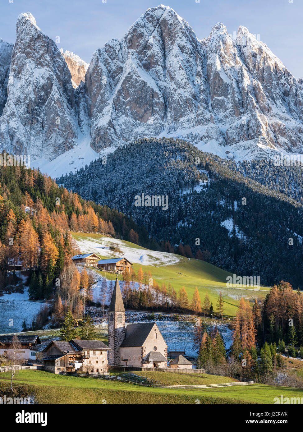 Church Sankt Magdalena in the Villnoess valley during autumn. The peaks ...