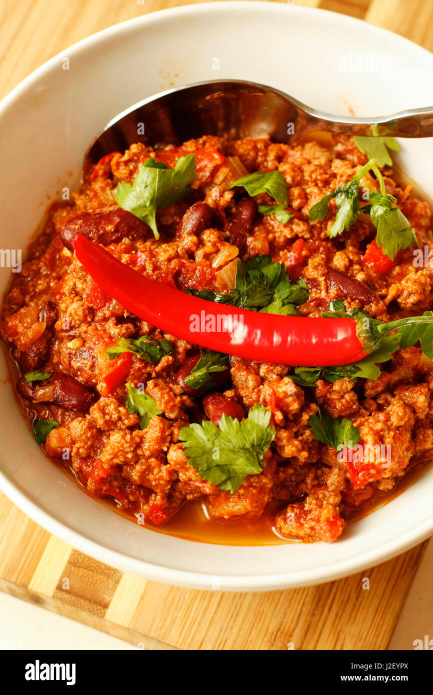 Chilli with minced beef and herbs on white bowl Stock Photo - Alamy