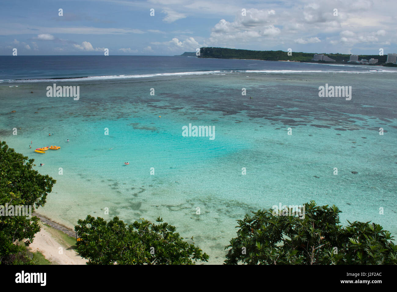 US Territory of Guam, Tamuning. Over view of popular Ypao Beach area at ...