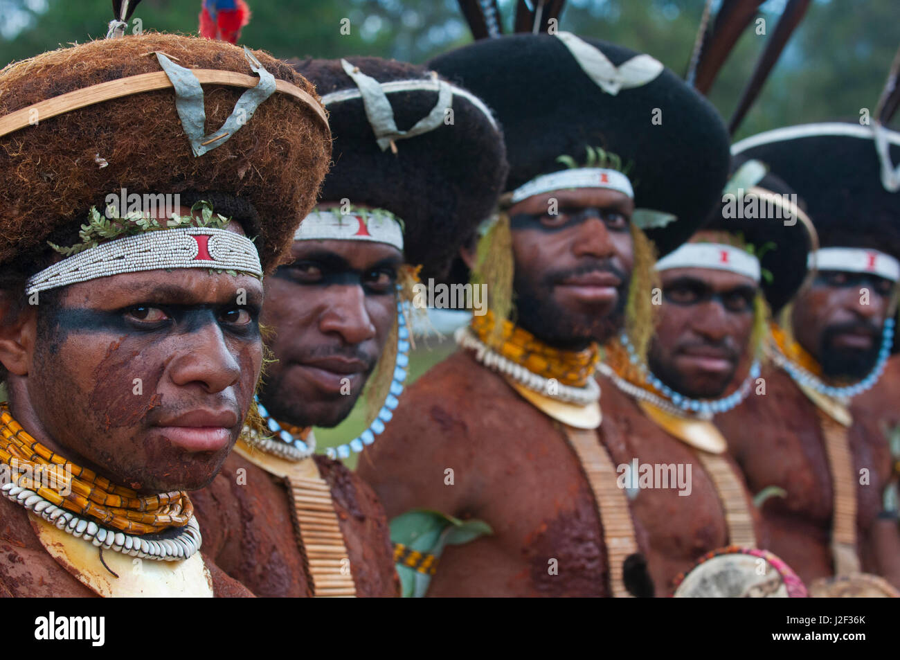 Colorful dress and face painted local tribes celebrating the ...