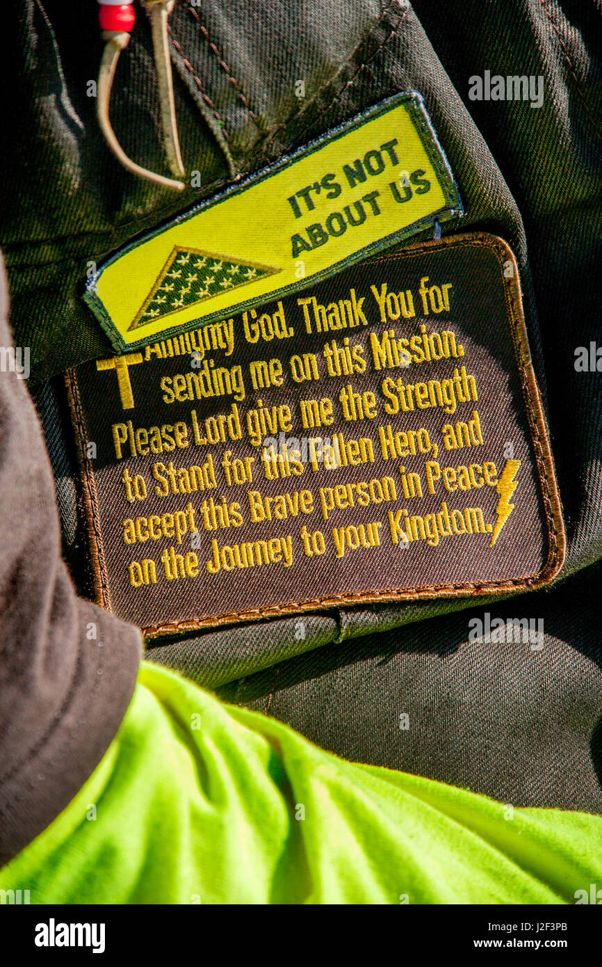 A motorcycle rider's jacket at a rally in Huntington Beach, CA, carries ...