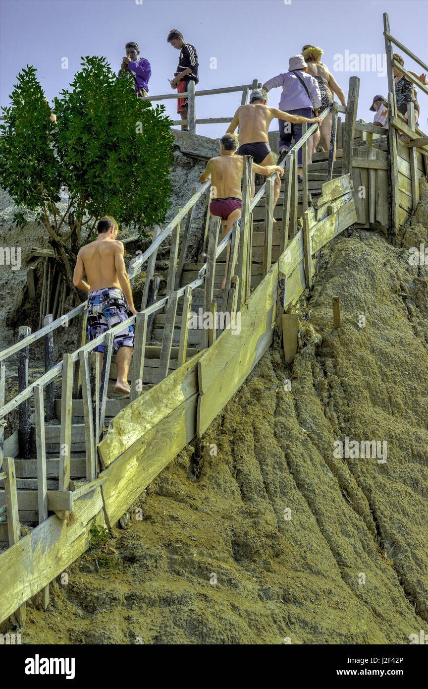 Bathers line up for a quick dip in the hot mud of Volcano, Volcan de ...