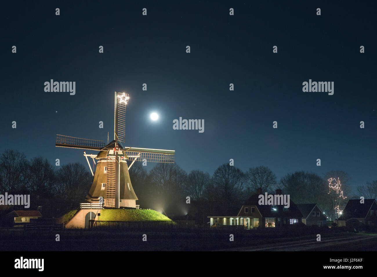 windmill with Xmas star under a full moon Stock Photo - Alamy