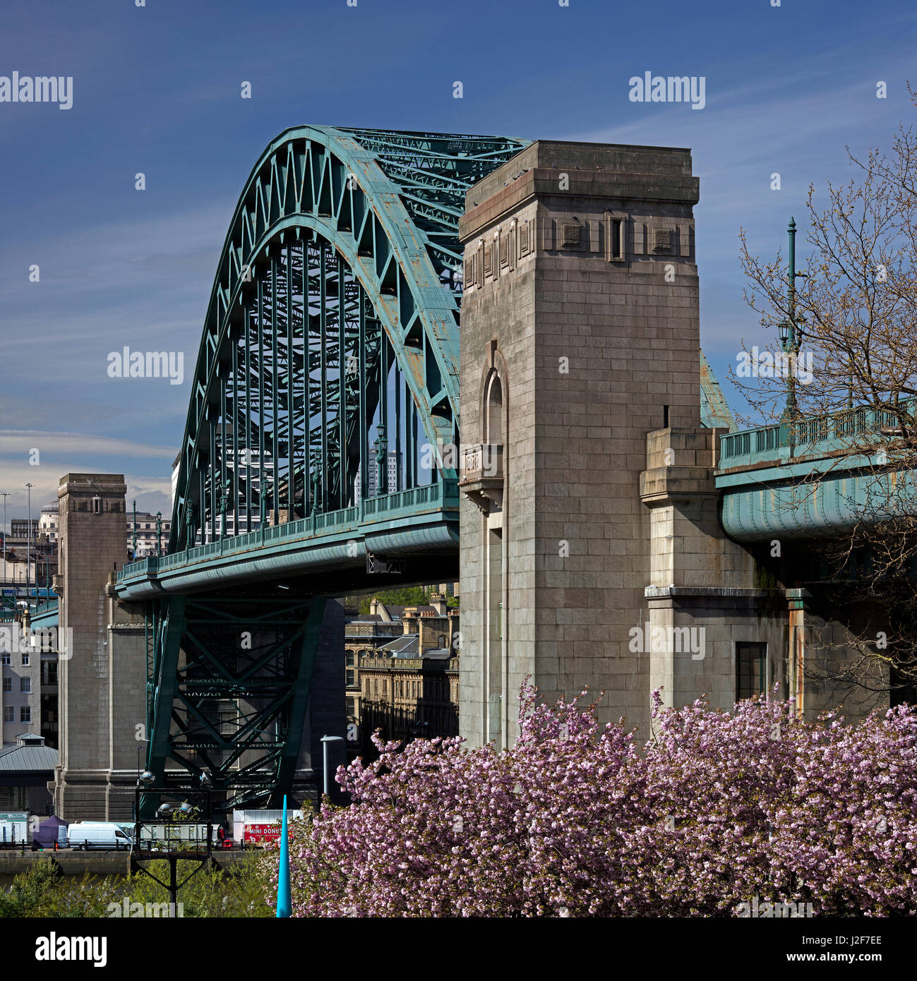 A daytime view of the Tyne Bridge against a summer-time blue sky in ...