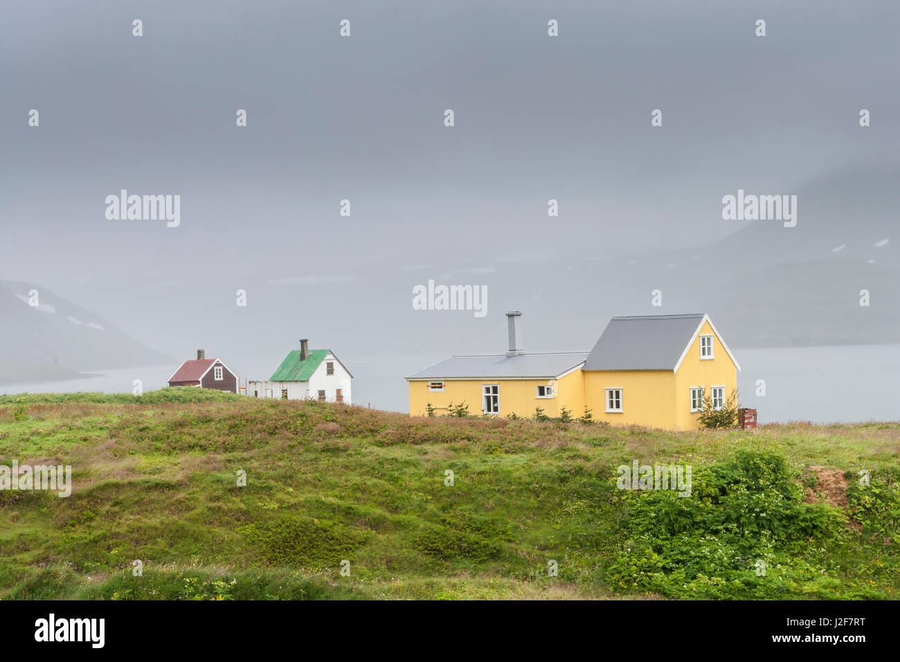 Restored houses in the abandoned village of Hesteyri in the Northwest ...