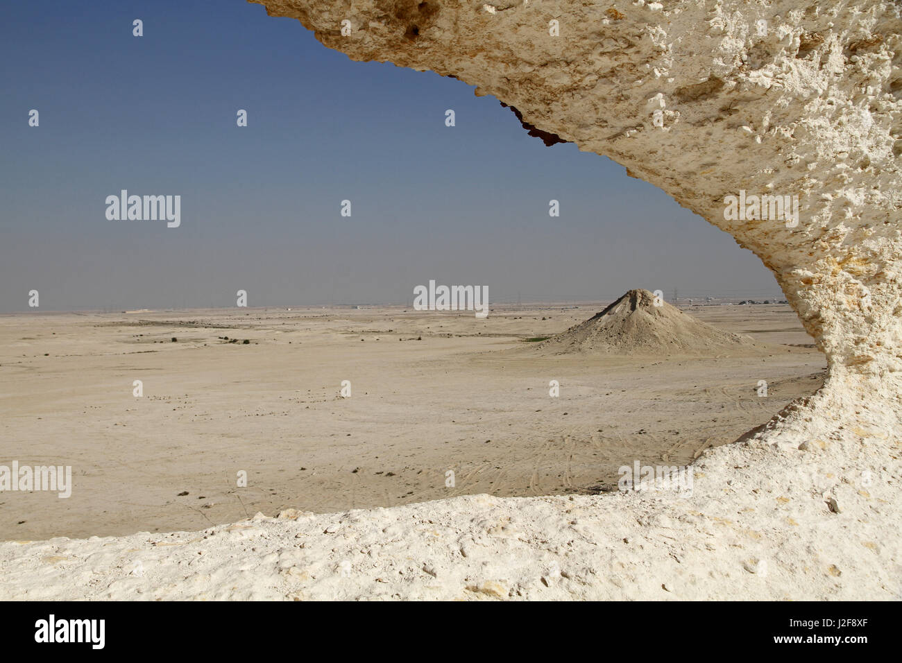 View through a hole in the limestone cliffs at Bir Zekreet Stock Photo ...