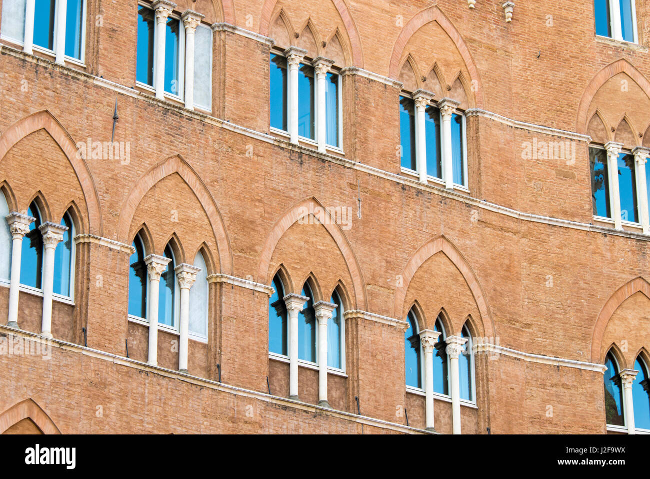 Europe, Italy, Siena. Detail of arches building facades Il Campo Stock ...