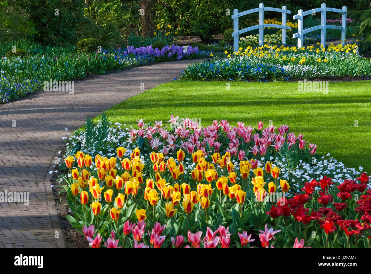Spring garden with bridge Stock Photo - Alamy