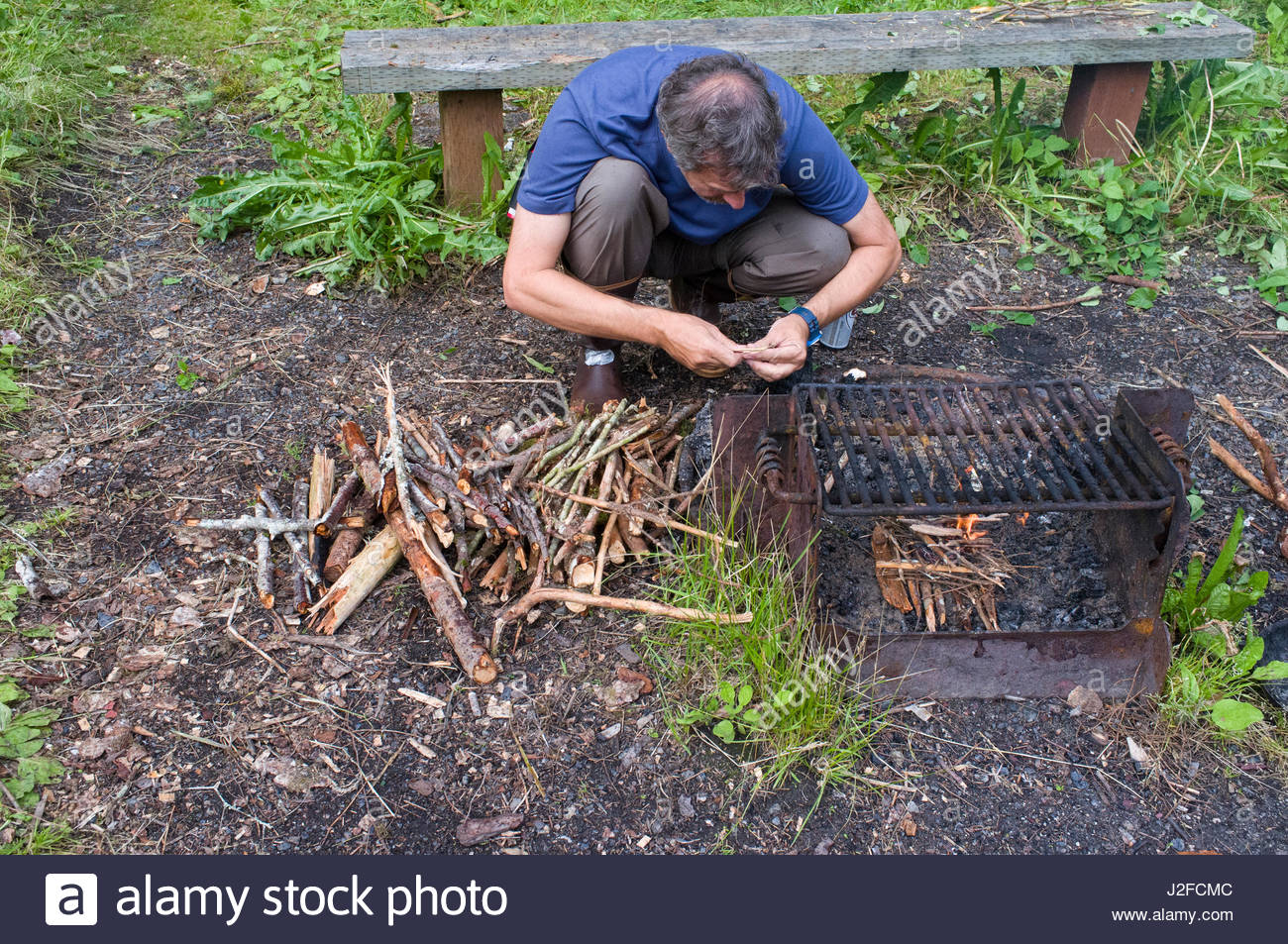 Man Starting Fire High Resolution Stock Photography and Images - Alamy