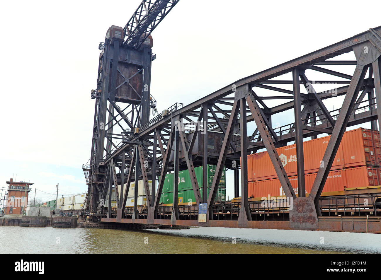 Freight train crossing a drawbridge over the Cuyahoga River in the port ...