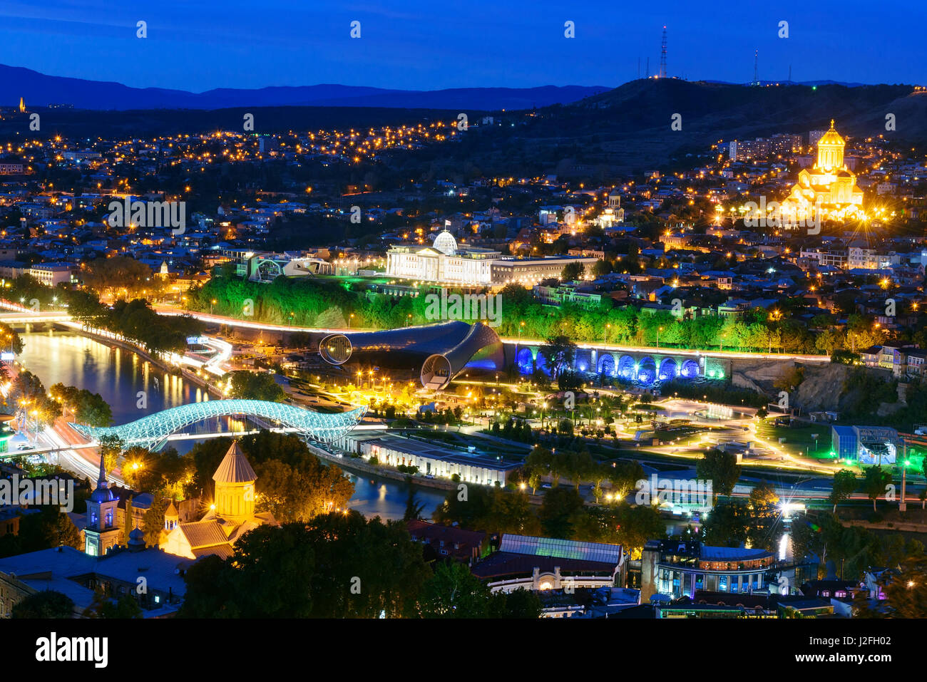 Night view of center Tbilisi city. Cityscape with evening illumination ...