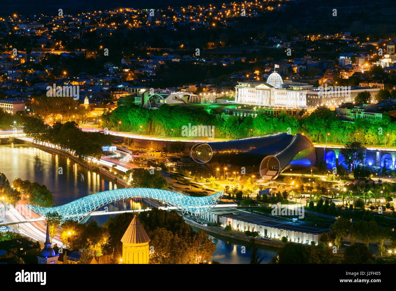 Night view of center Tbilisi city. Cityscape with evening illumination ...