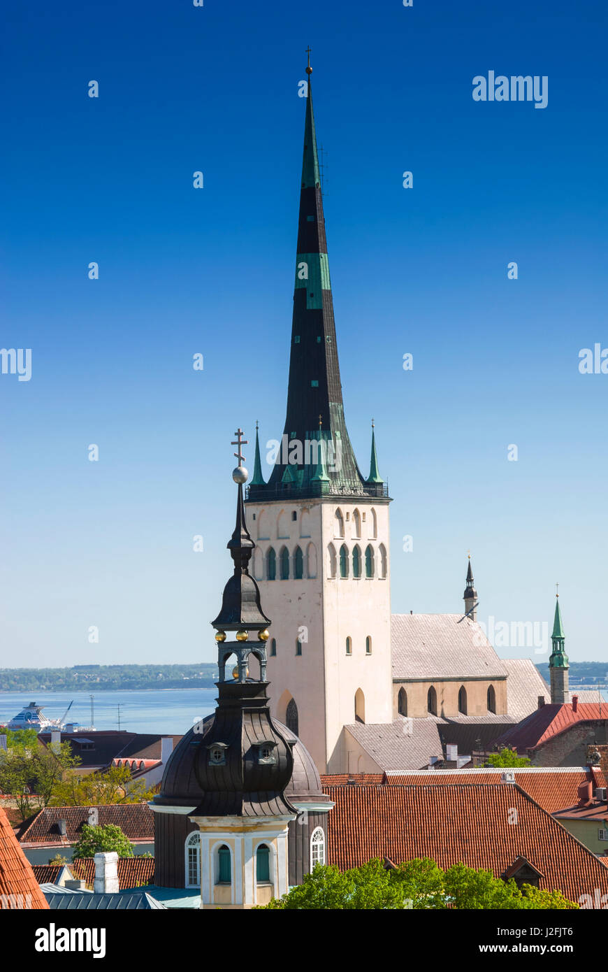 Medieval town walls and spire of St. Olav church, view of Tallinn from ...
