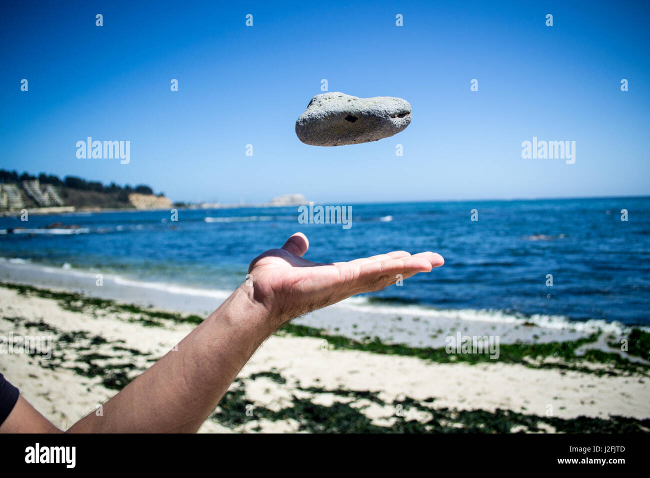 Man throwing stone in hi-res stock photography and images - Alamy