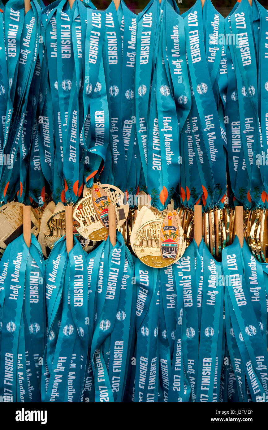 Gold medallions on neck ribbons for runners completing a half marathon ...