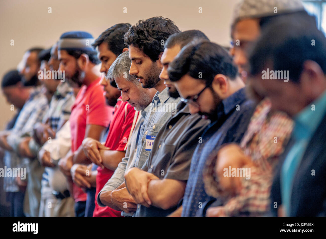 Muslim men of many ages gather for Friday afternoon prayers during ...
