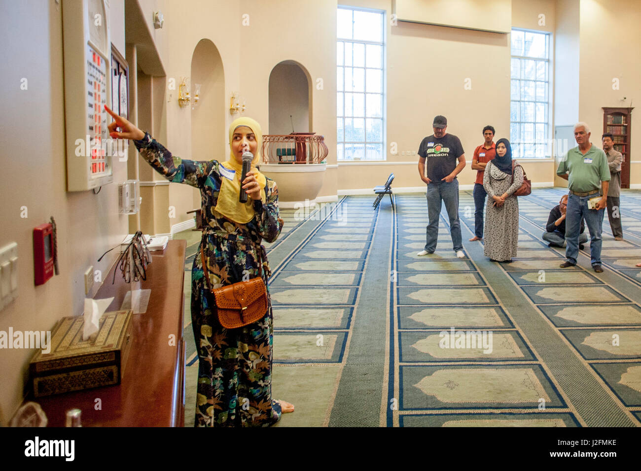 A Muslim woman in traditional Middle Eastern clothing explains the ...
