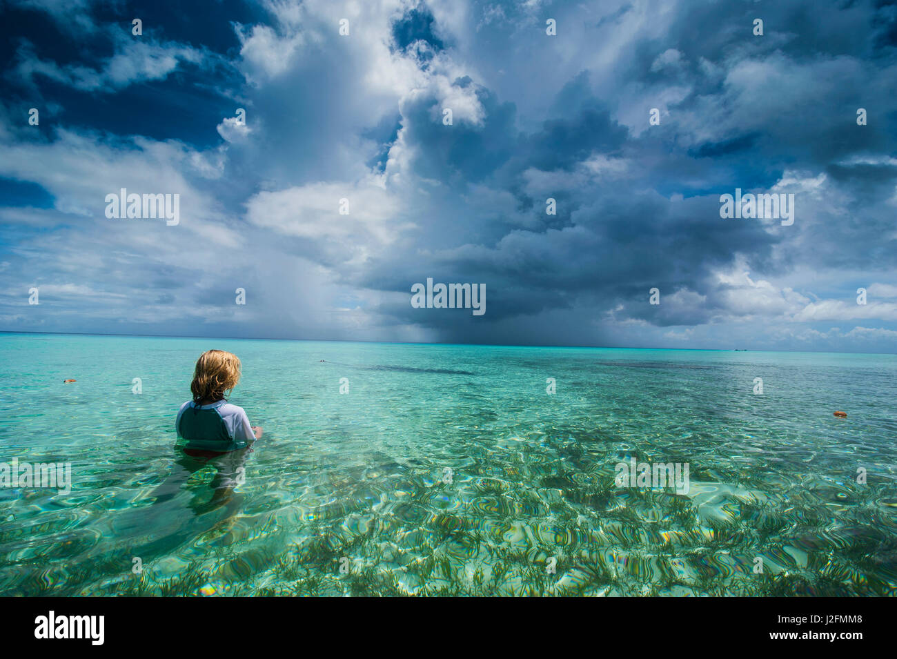 Tourist in the incredible blue waters of the Ant Atoll, Pohnpei ...