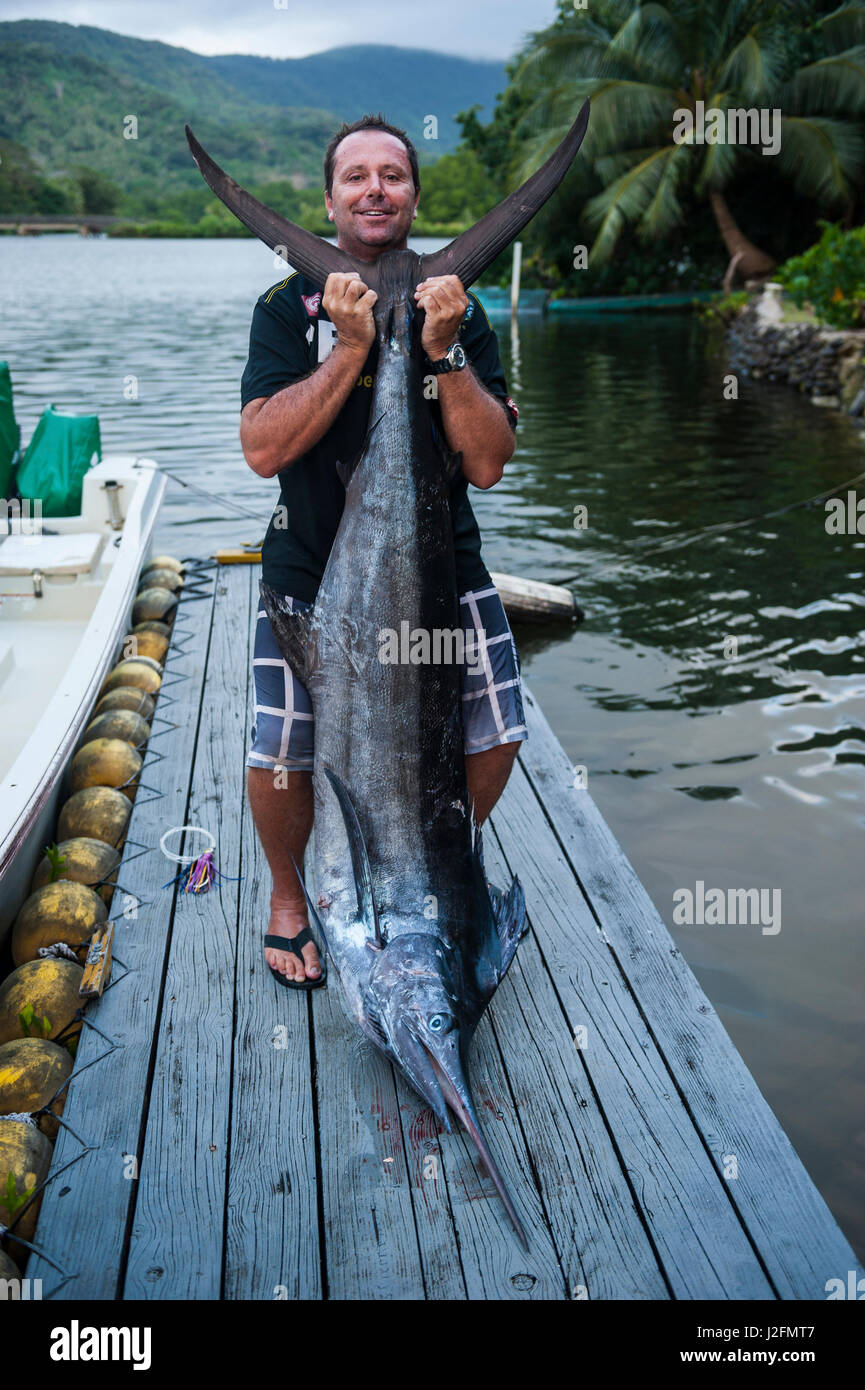 Man with huge swordfish, Pohnpei, Micronesia, Central Pacific Stock ...