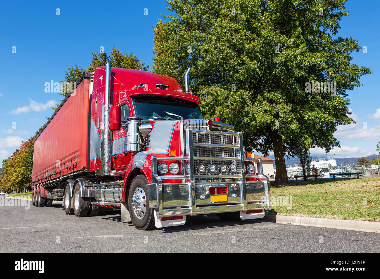 Vivid red semi truck parked in rural town, Australia Stock Photo - Alamy
