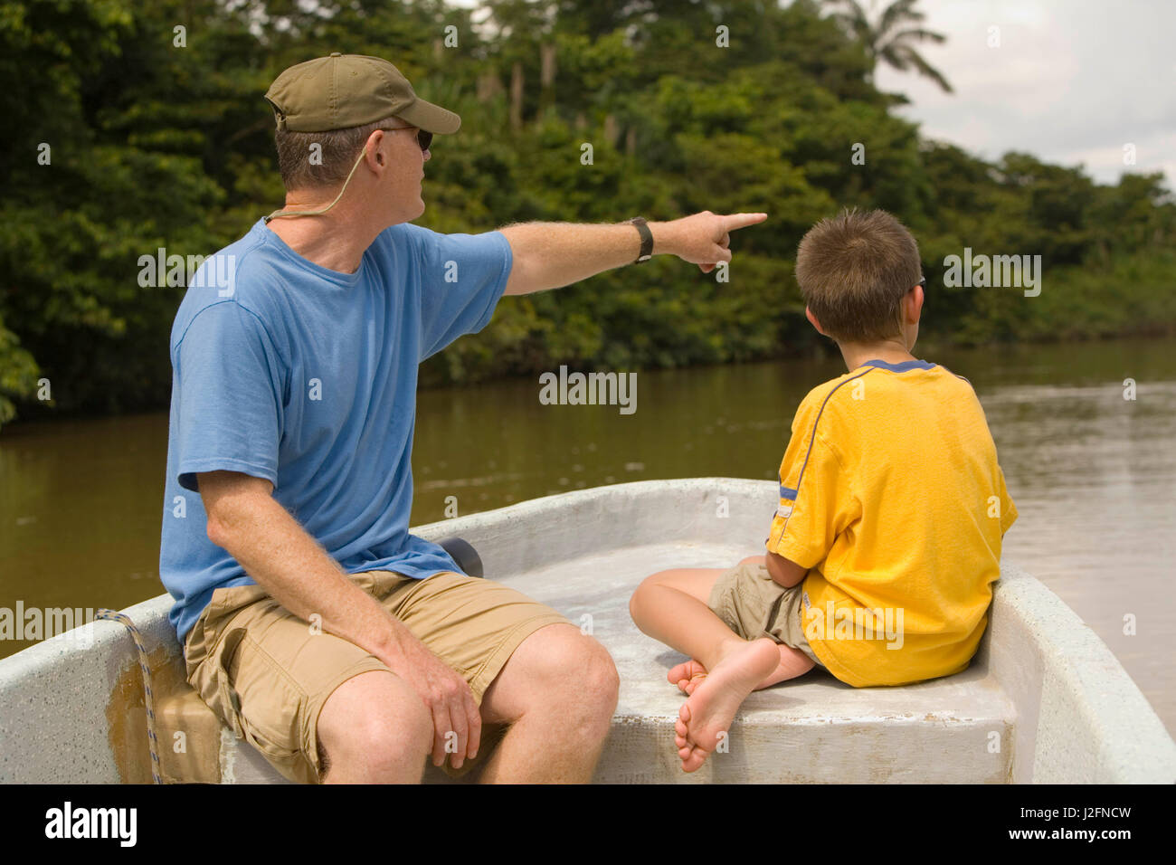 Central America, Belize, Placencia, Monkey river, man and boy (age 8 ...