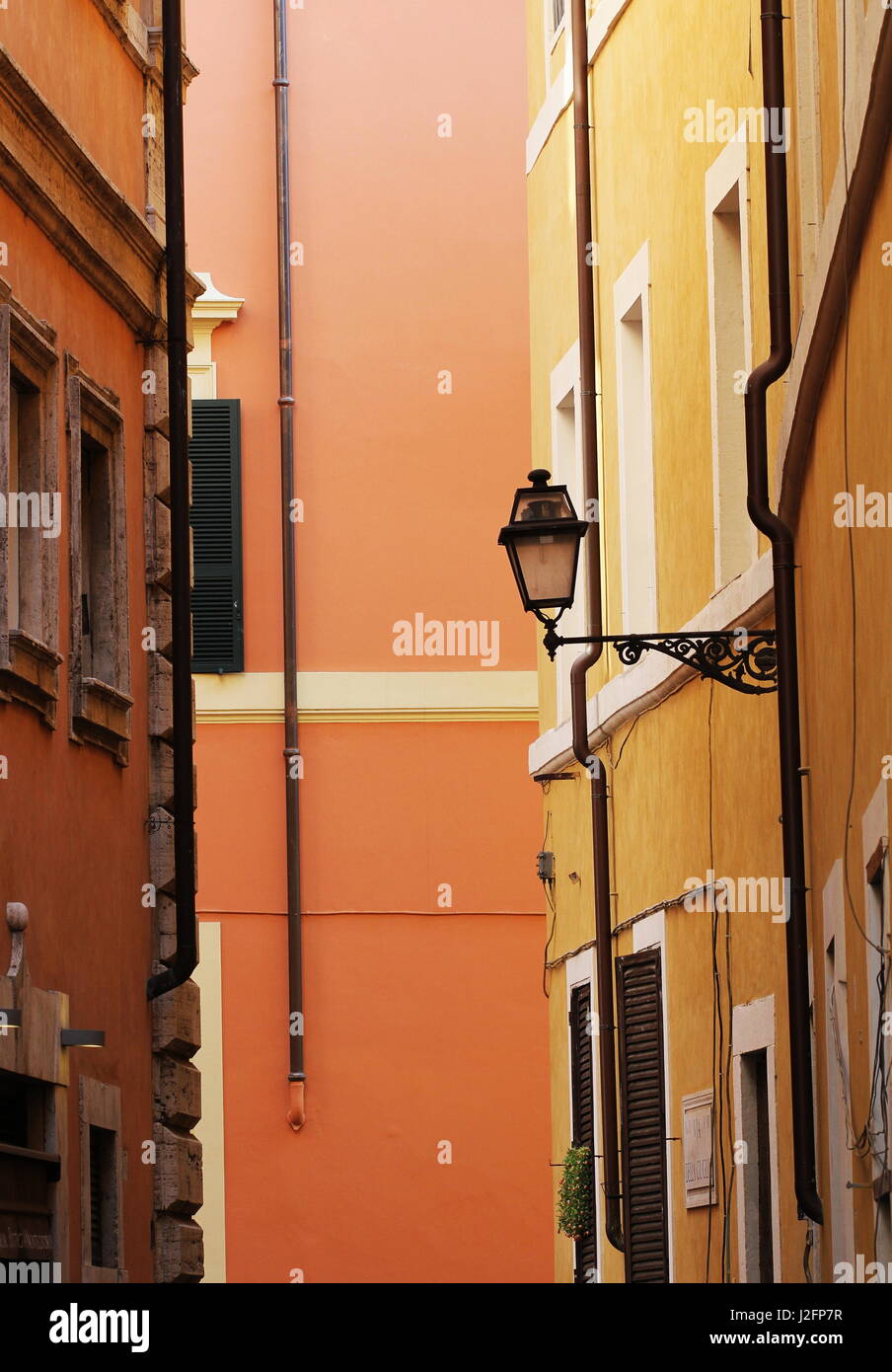 Medieval street lamp in narrow street in Rome , Italy Stock Photo - Alamy