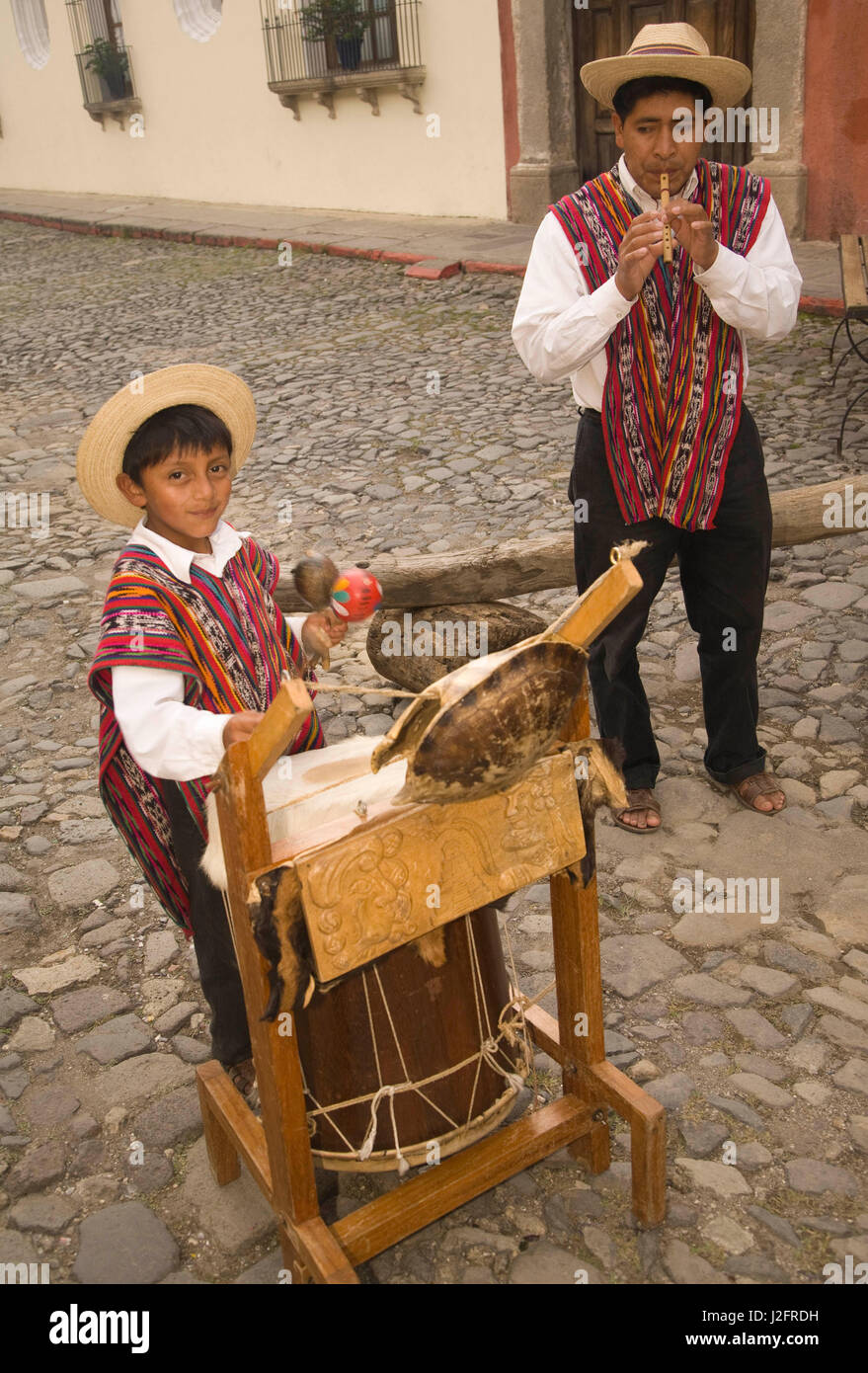 Central America, Guatemala, Antigua. Father and son musicians perform ...