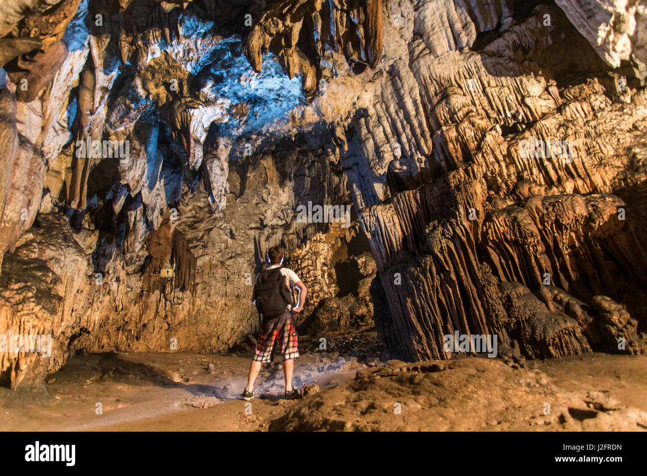 People explore the Grutas de Lanquin, which is a remote bat cave in ...