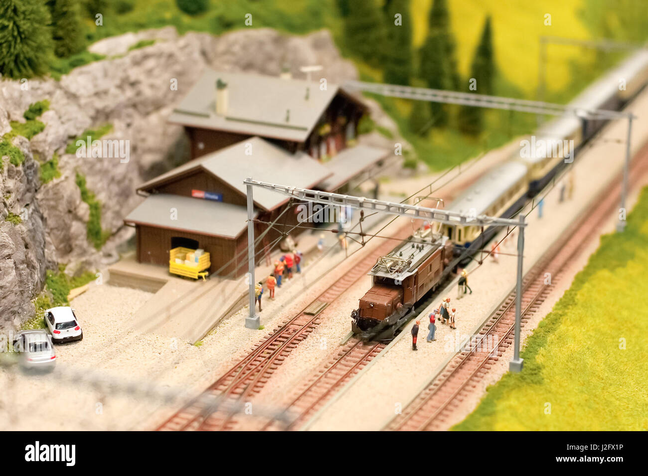 miniature alpine railroad model with overhead electric power lines ...