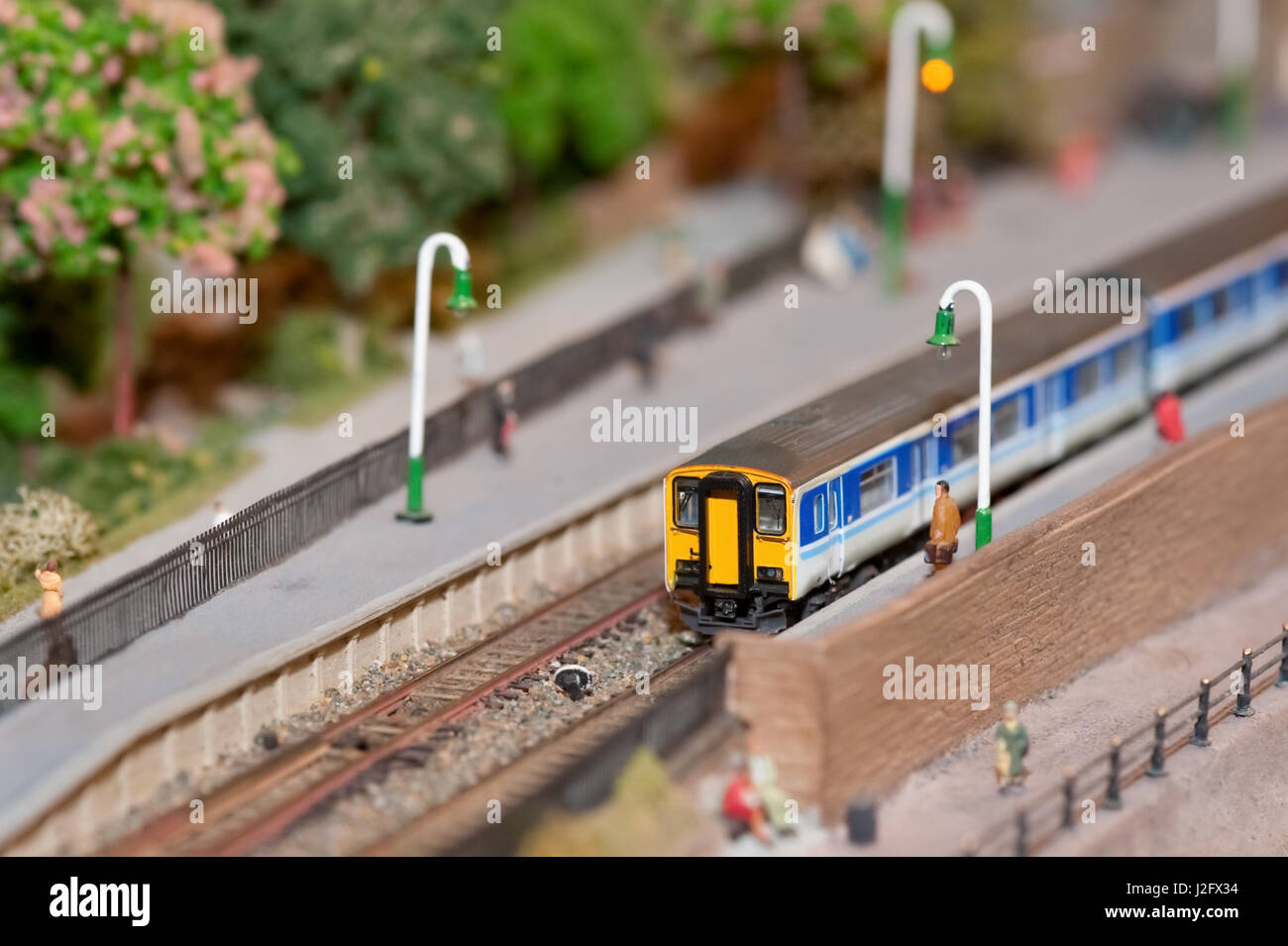 miniature model commuter train in a station with shallow d.o.f Stock ...