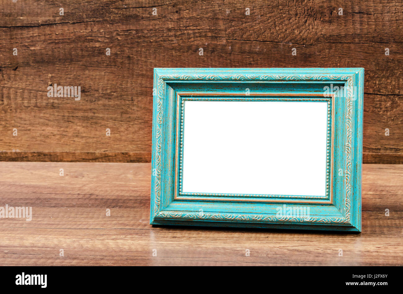 Blue blank photo frame on wooden room. Save clipping path Stock Photo ...
