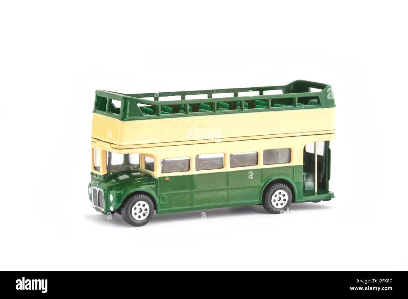 miniature scale model of a vintage open-top tour bus on white Stock ...