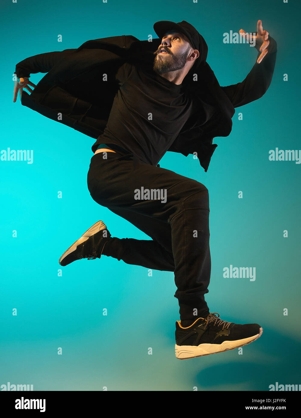 The silhouette of one young hip hop male break dancer dancing on ...