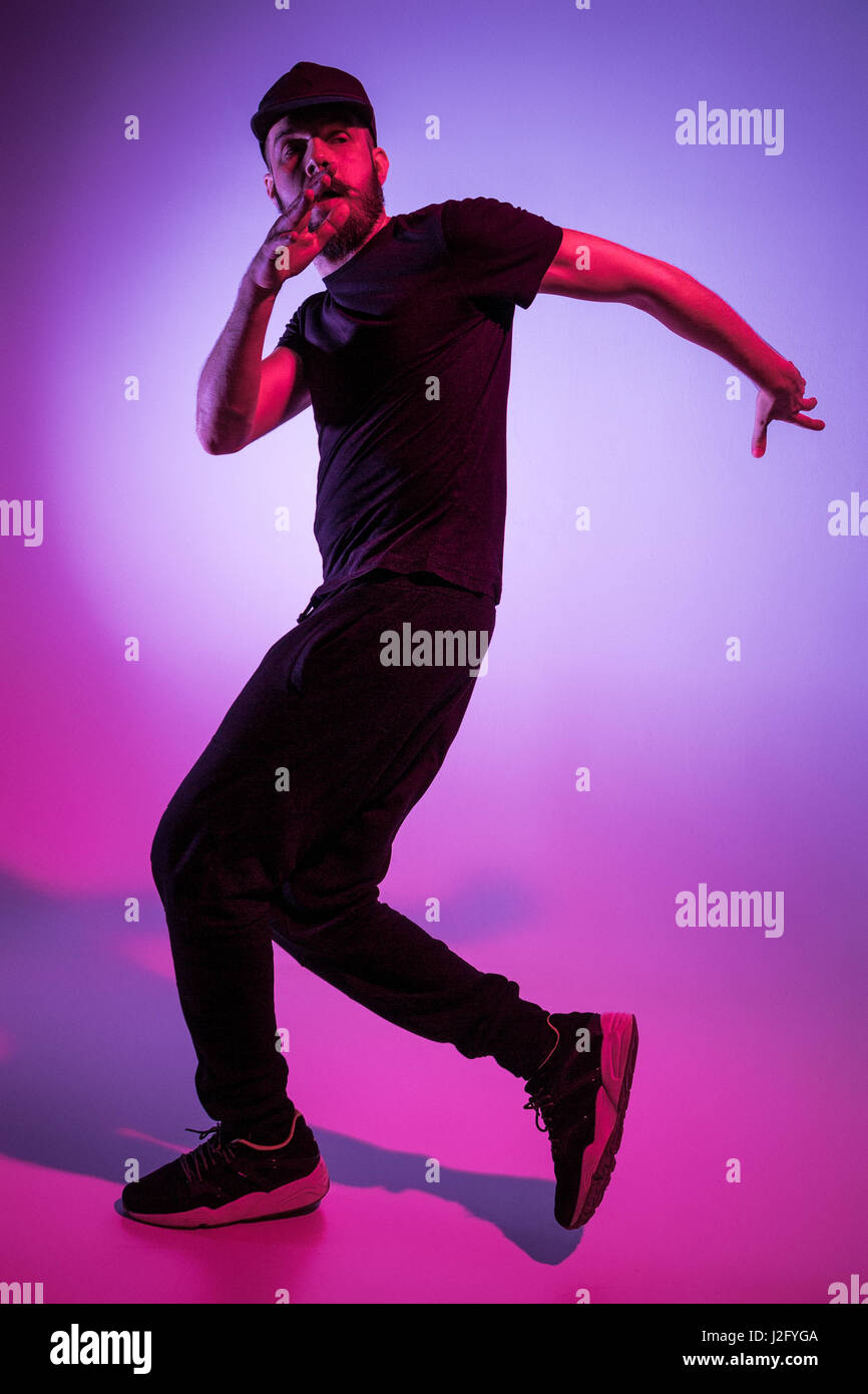 The silhouette of one young hip hop male break dancer dancing on ...