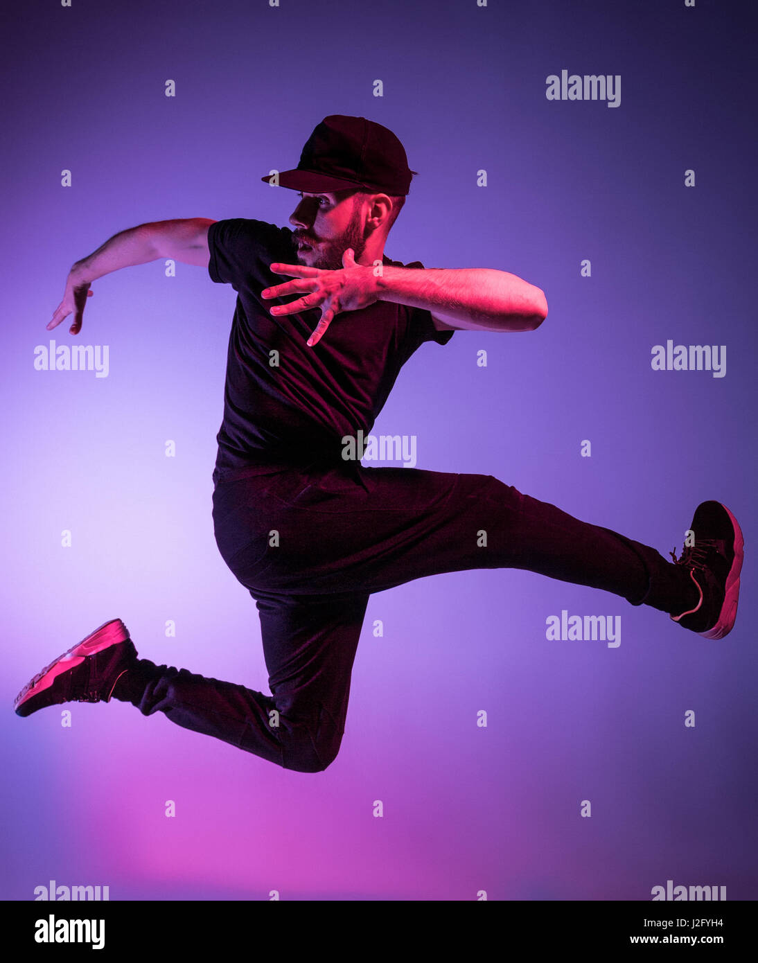 The silhouette of one young hip hop male break dancer dancing on ...