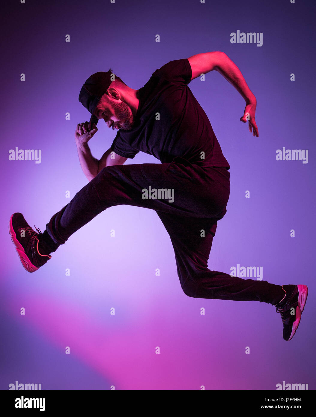 The silhouette of one young hip hop male break dancer dancing on ...