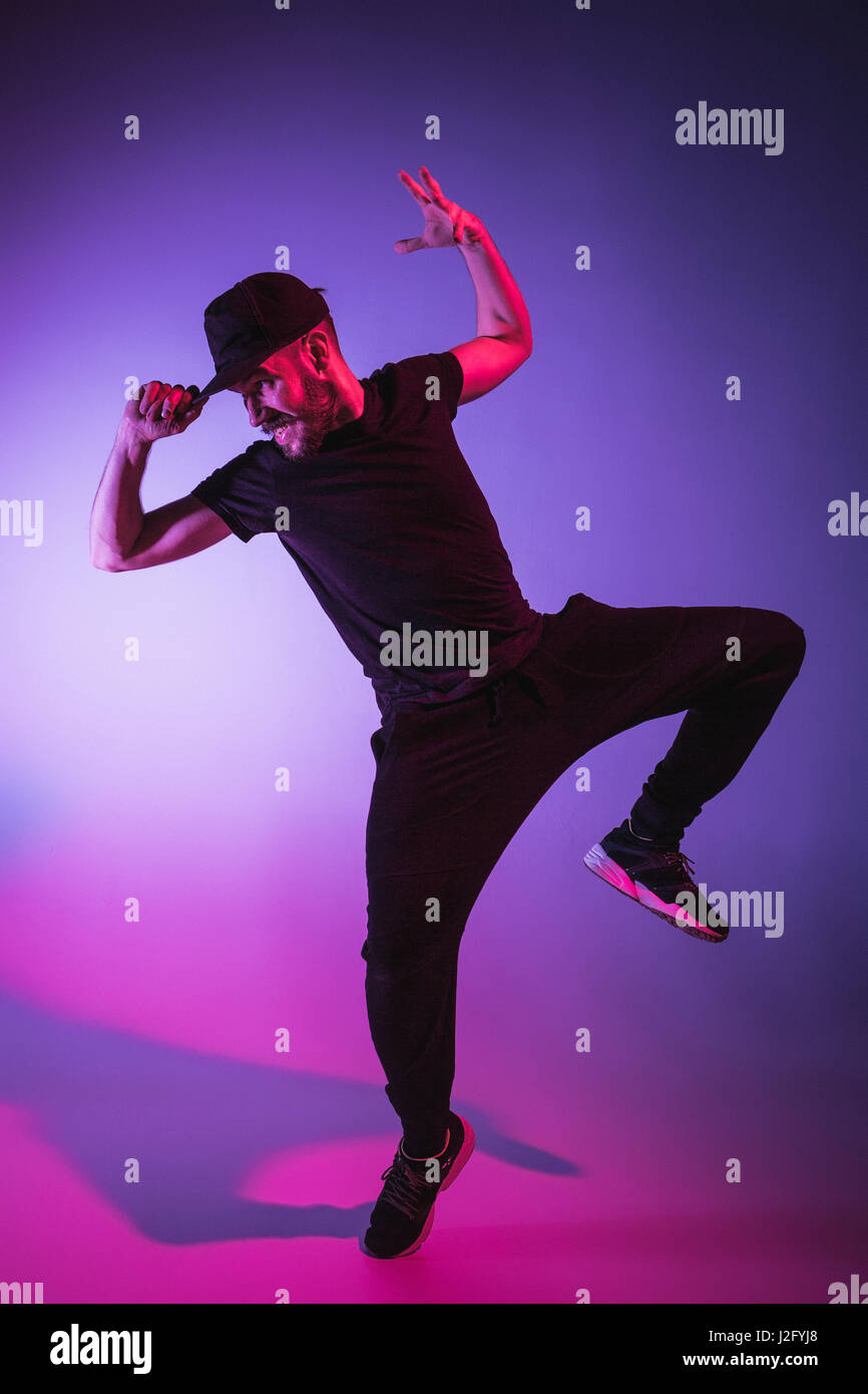 The silhouette of one young hip hop male break dancer dancing on ...