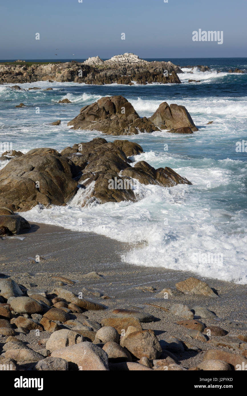 Waves, blue water and rocks along Monterey Peninsula, California coast ...
