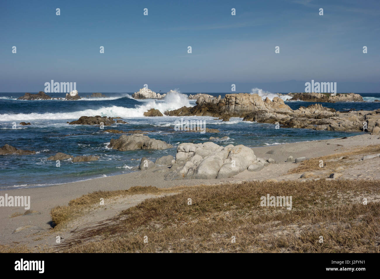 Waves, blue water and rocks along Monterey Peninsula, California coast ...